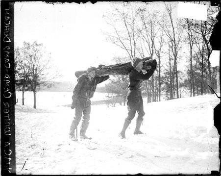 Chicago History Museum Images - Two men carrying a long log over their ...